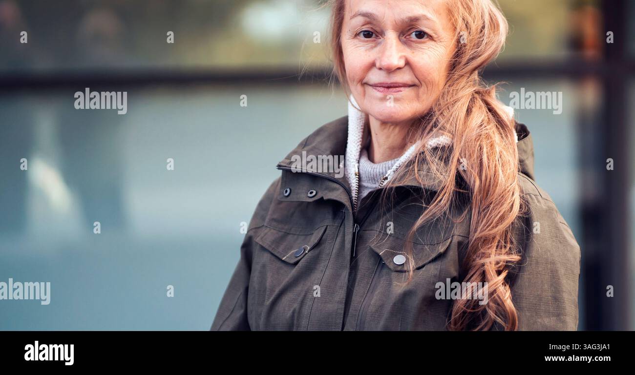 A portrait of a lady, a 60 age charming woman with a smiley face Stock ...