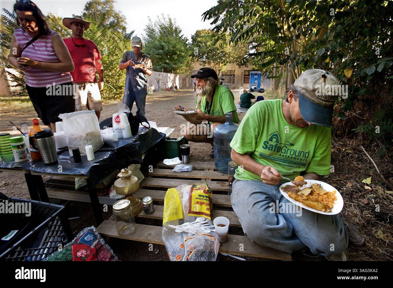 LEDE-- Homeless campers have a final meal on Sunday, September 20, 2009 ...