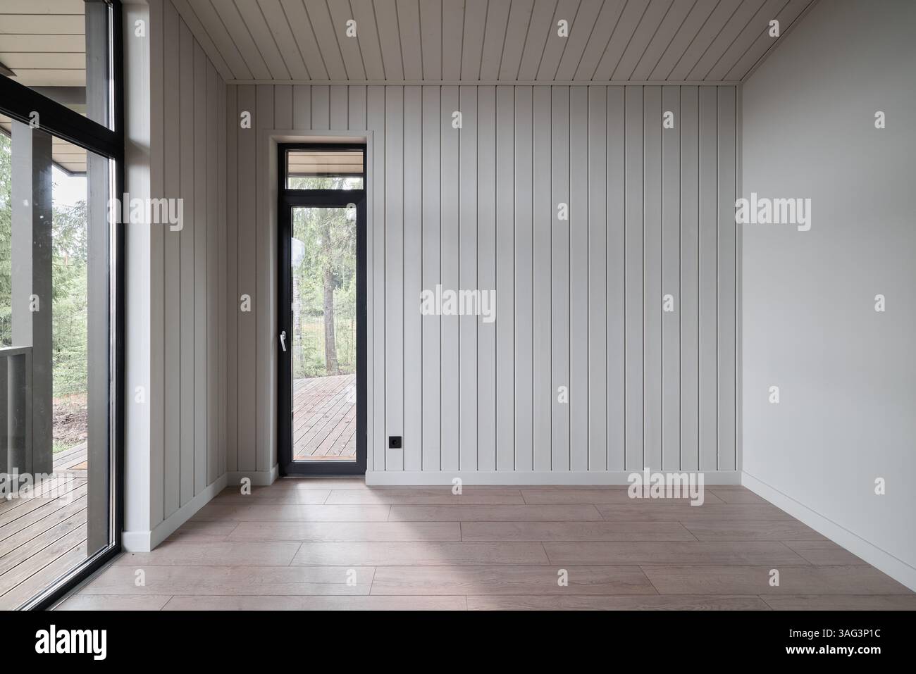 The modern interior space features an abundance of natural light and a ...