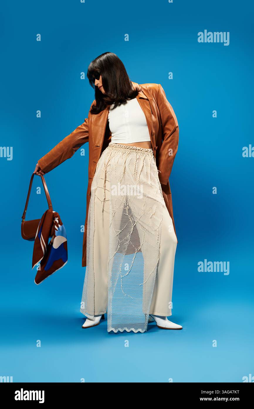 Stylish young woman embraces modern fashion trends with a chic outfit ...