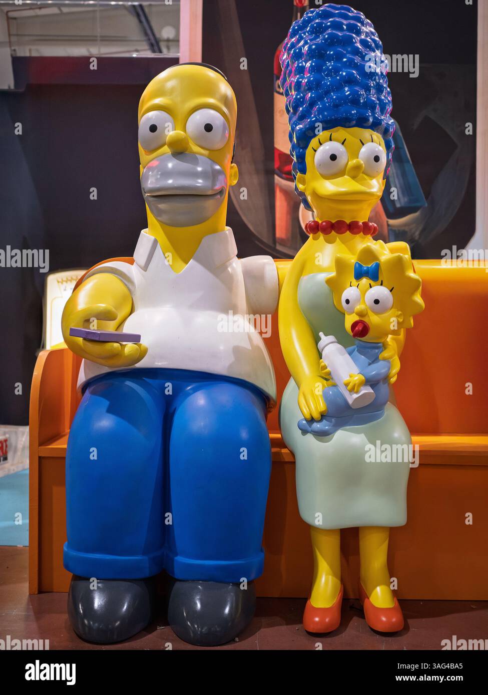 The Simpsons family, statue of Homer, Marge, and Maggie on an orange ...