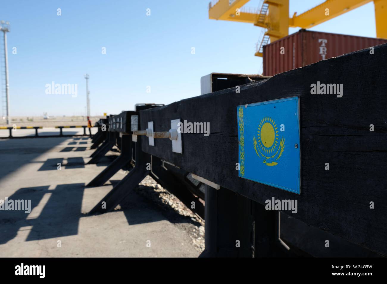 Unloading containers at the logistics center. Machines and cranes drag ...