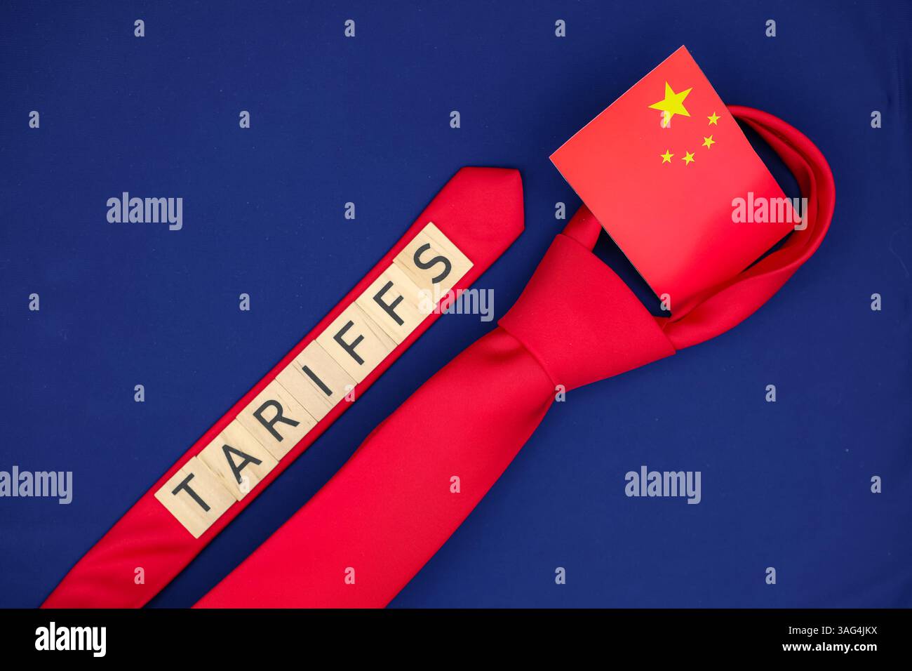 Symbolic Chinese Flag is in the Loop of a Red Tie. "Tariffs " Word is on the Tie. US Tax Policy ...