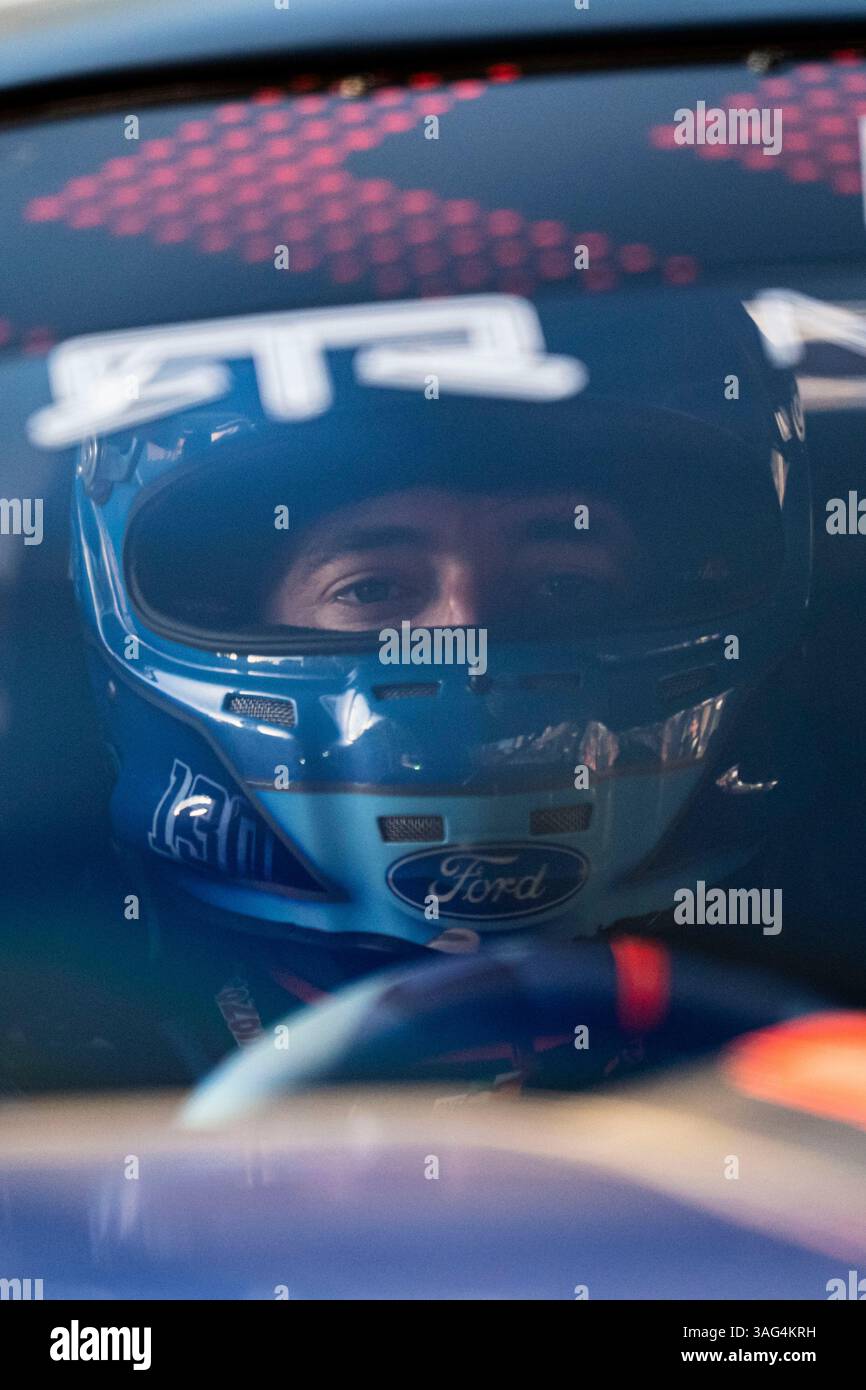 James Deane driver of the RTR Mustang looks ahead as he awaits his turn ...
