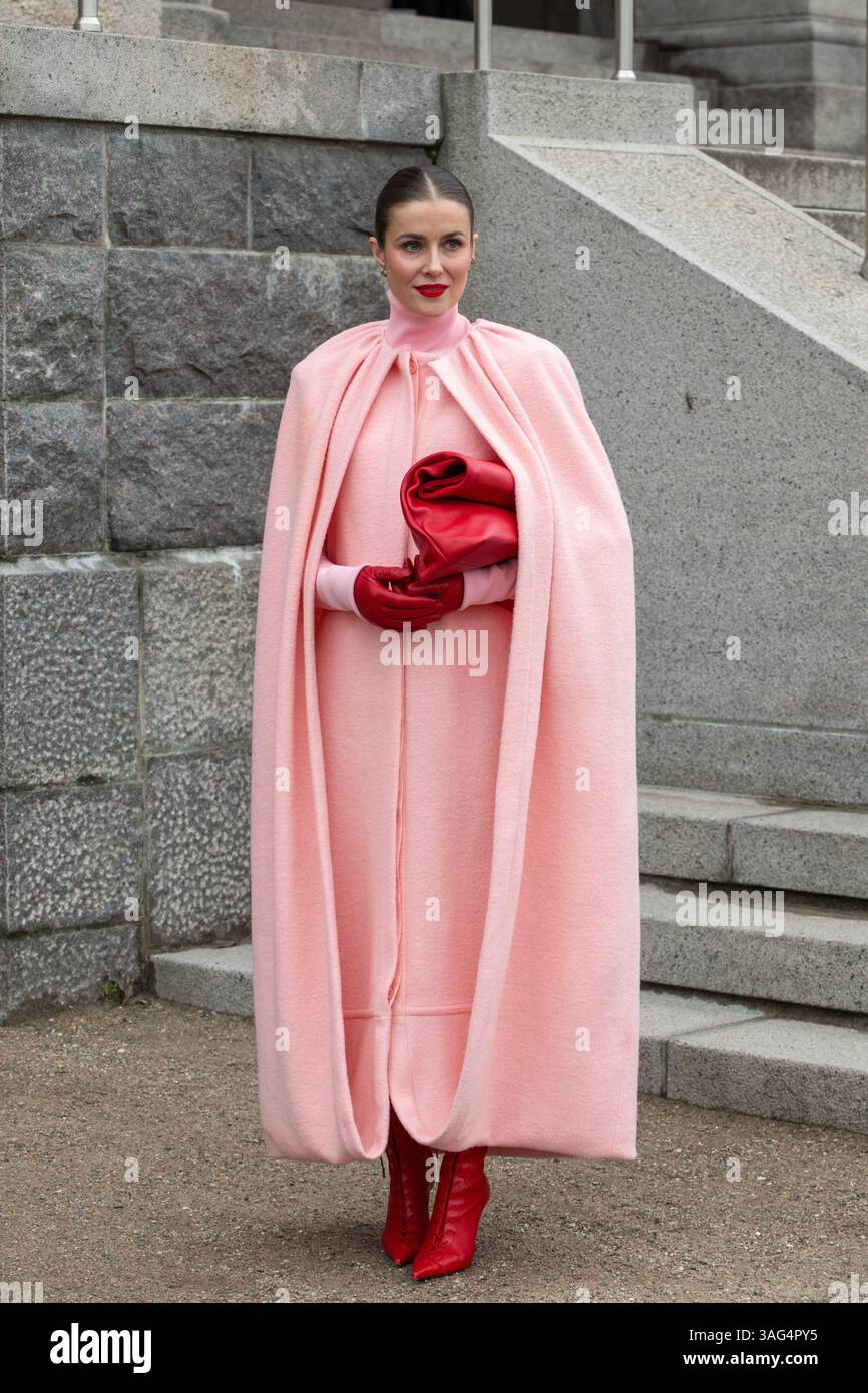 Nina Sandbech at Copenhagen Fashion Week 2025 in a bold pink cape ...