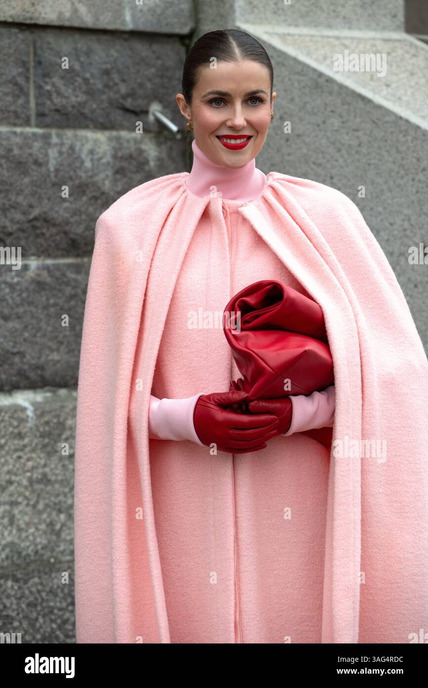 Nina Sandbech at Copenhagen Fashion Week 2025 in a bold pink cape ...