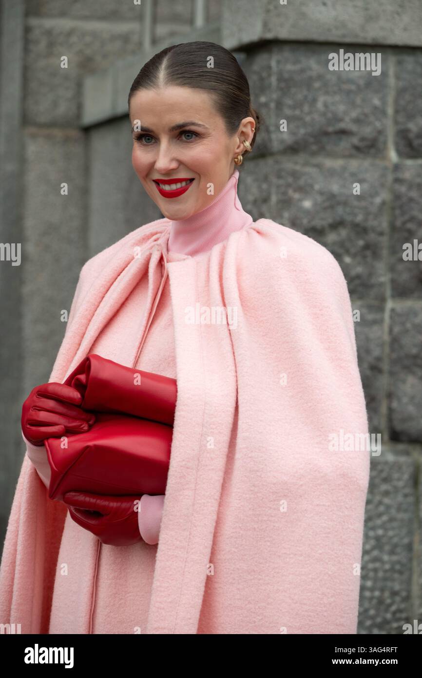 Nina Sandbech at Copenhagen Fashion Week 2025 in a bold pink cape ...