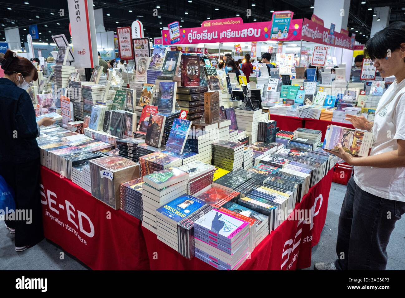 Visitors seen checking out books on display during the 53rd Thailand ...