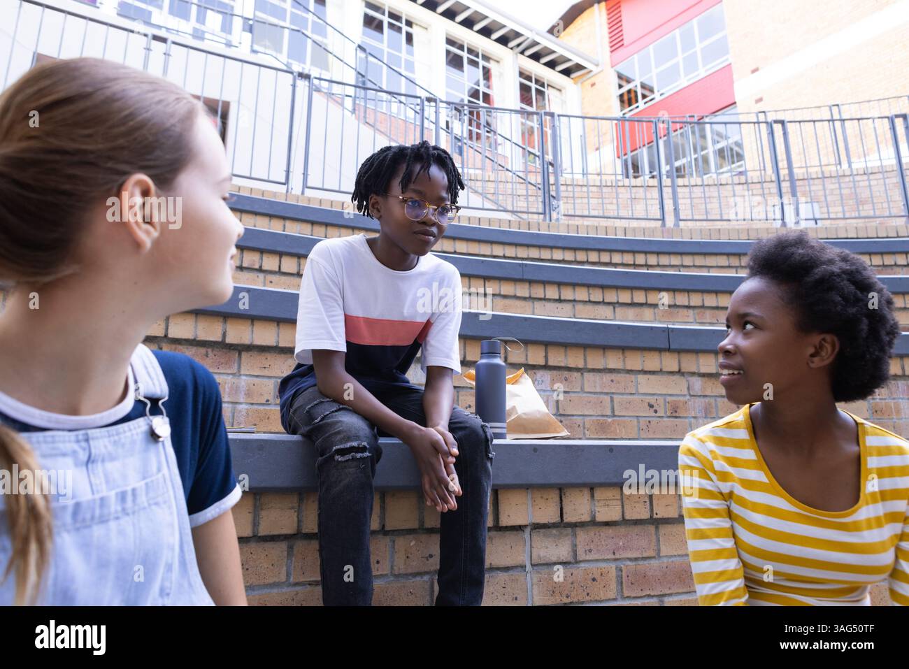 Group kids students talking on hi-res stock photography and images - Alamy