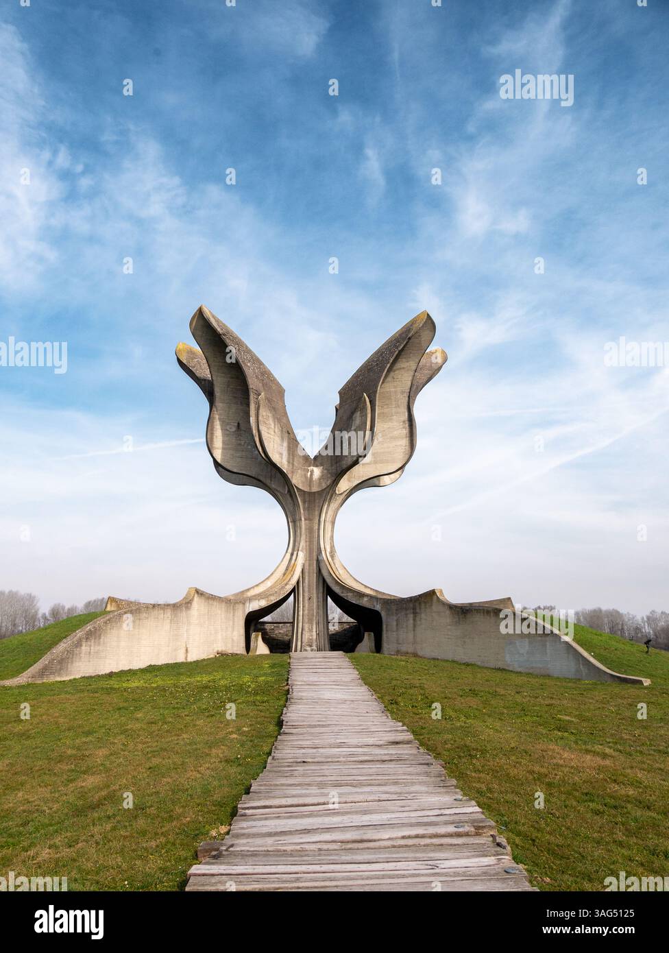 Pathway to Jasenovac Concentration Camp Memorial in Croatia on a clear ...