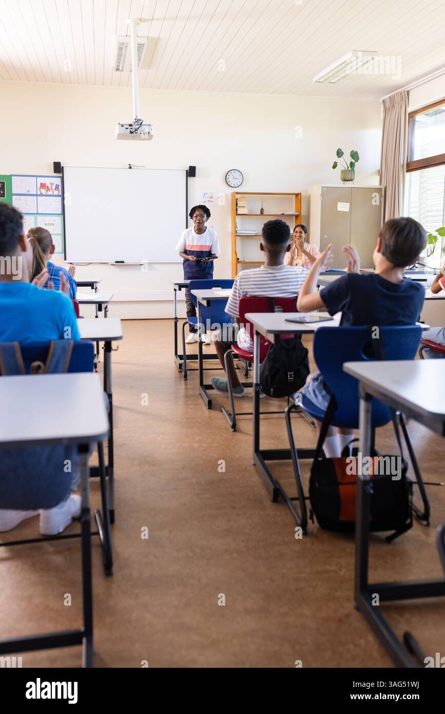 Indian female teacher leading classroom discussion with students ...