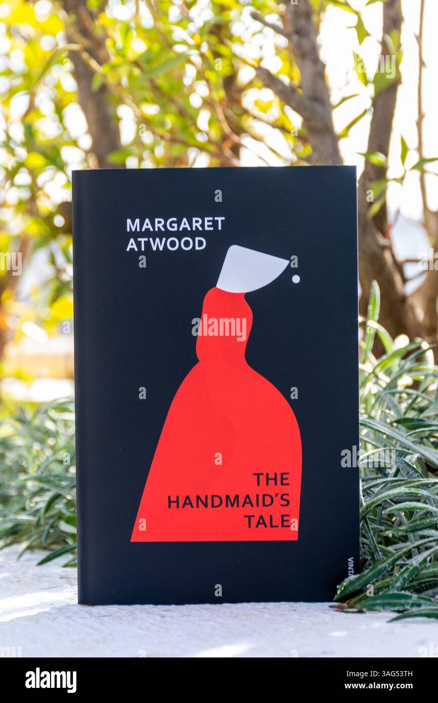 Close-up of Margaret Atwood's The Handmaid's Tale novel in the garden ...