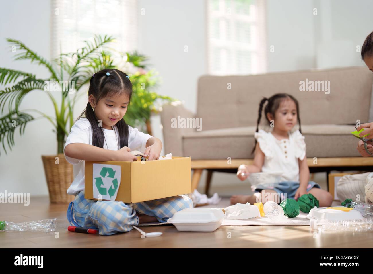Recycling and Environmental Awareness. Children having fun while learning the importance of ...