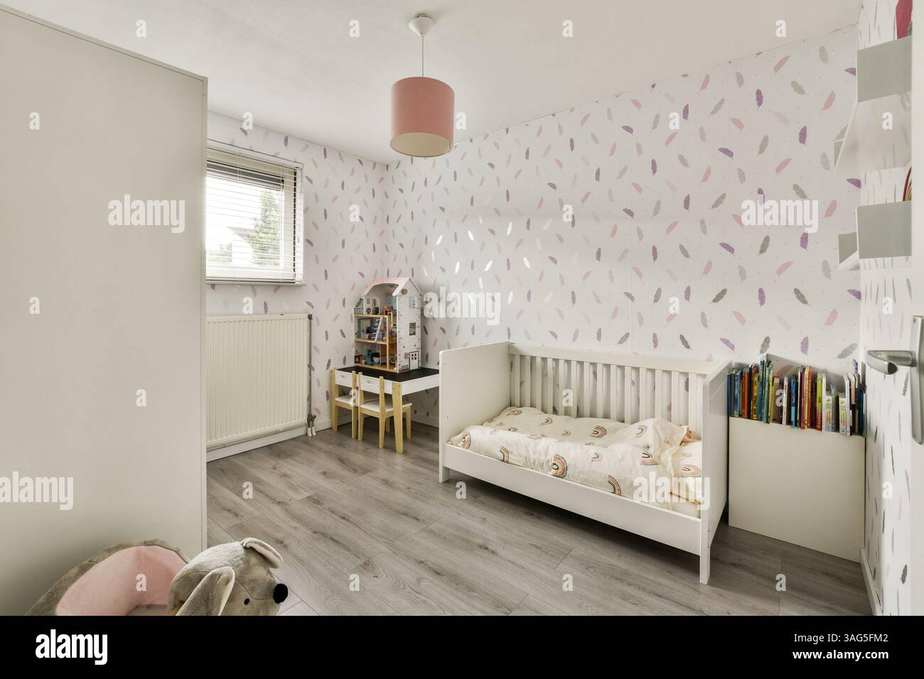 A beautifully decorated nursery featuring soft colors, playful patterns ...