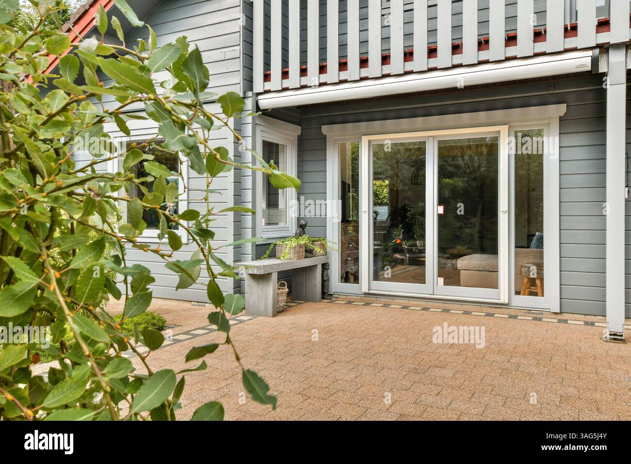 This modern house features a sleek design, large windows, and a ...