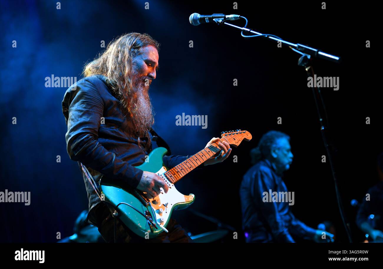 Liam Sean "Skin" Tyson plays guitar as Robert Plant looks on during the ...
