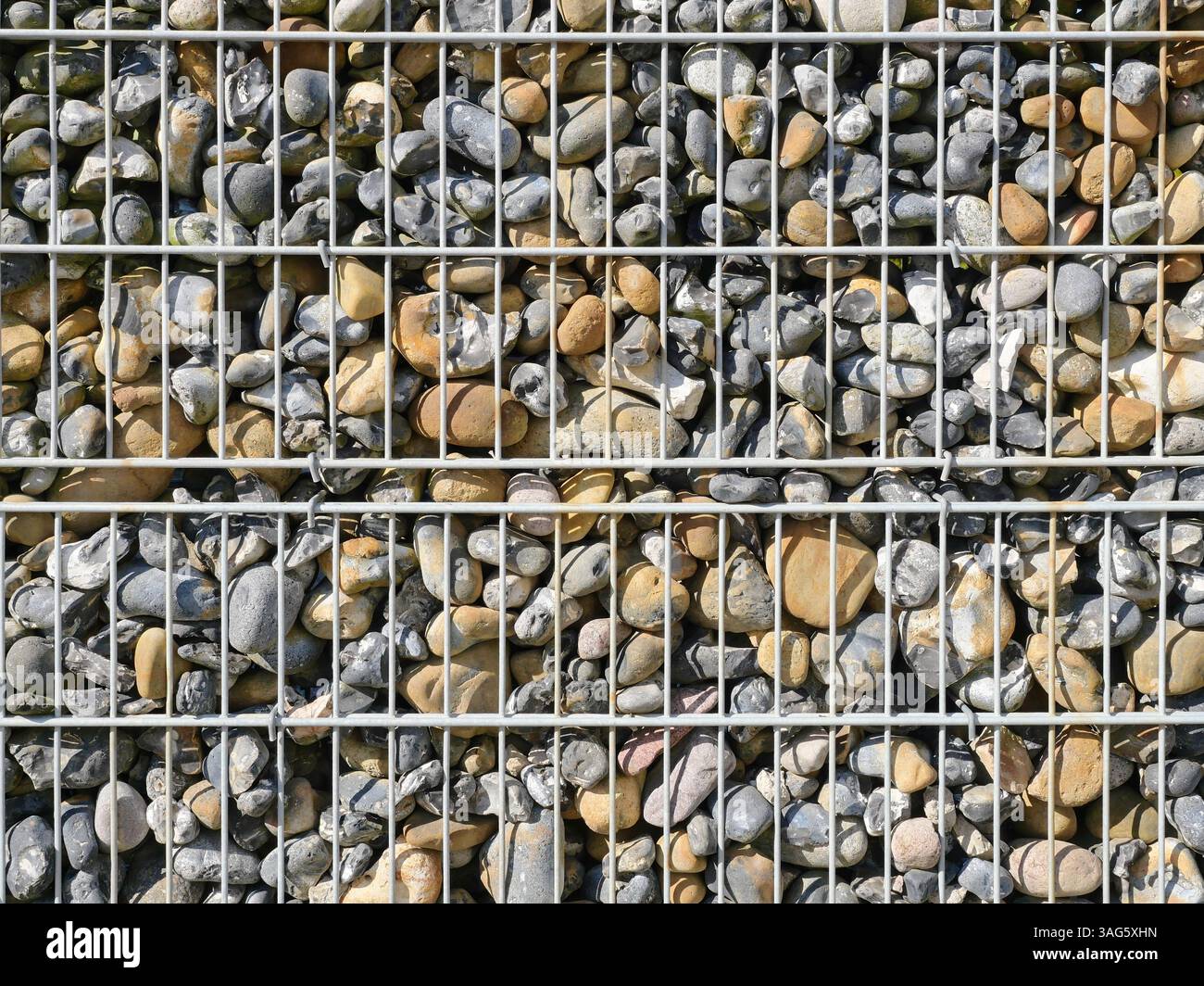 Gabion fence filled with flintstones, stable and durable. Controversial ...