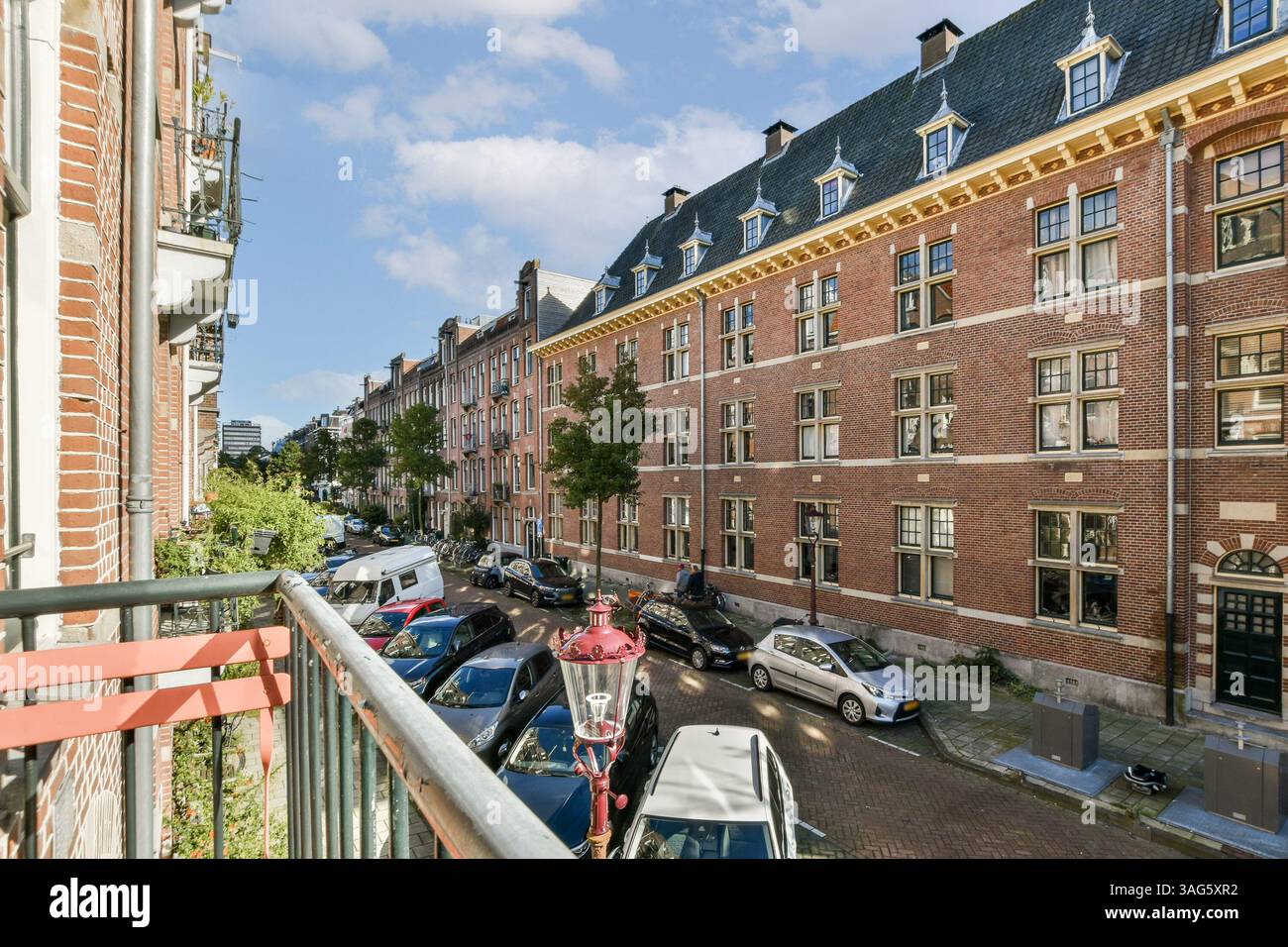 A picturesque street featuring classic brick architecture with trees ...