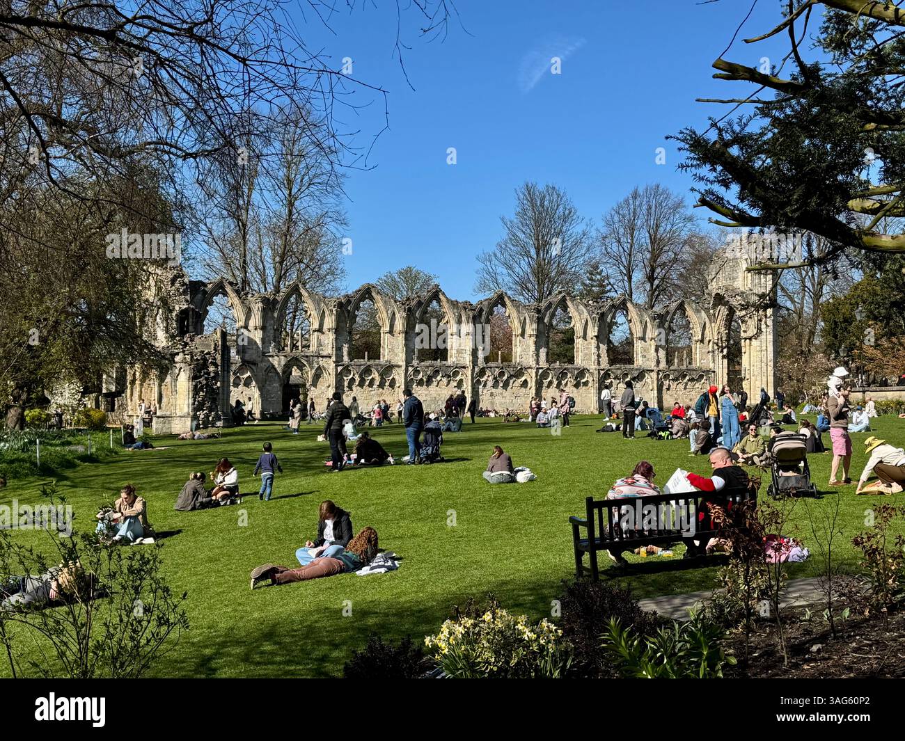 Tourists outside The Abbey of St Mary, a ruined Benedictine abbey in ...