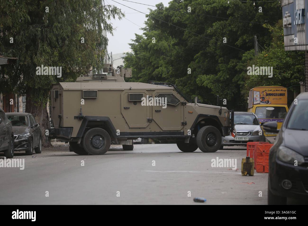 Israeli army armoured vehicles moves along a road during a military ...