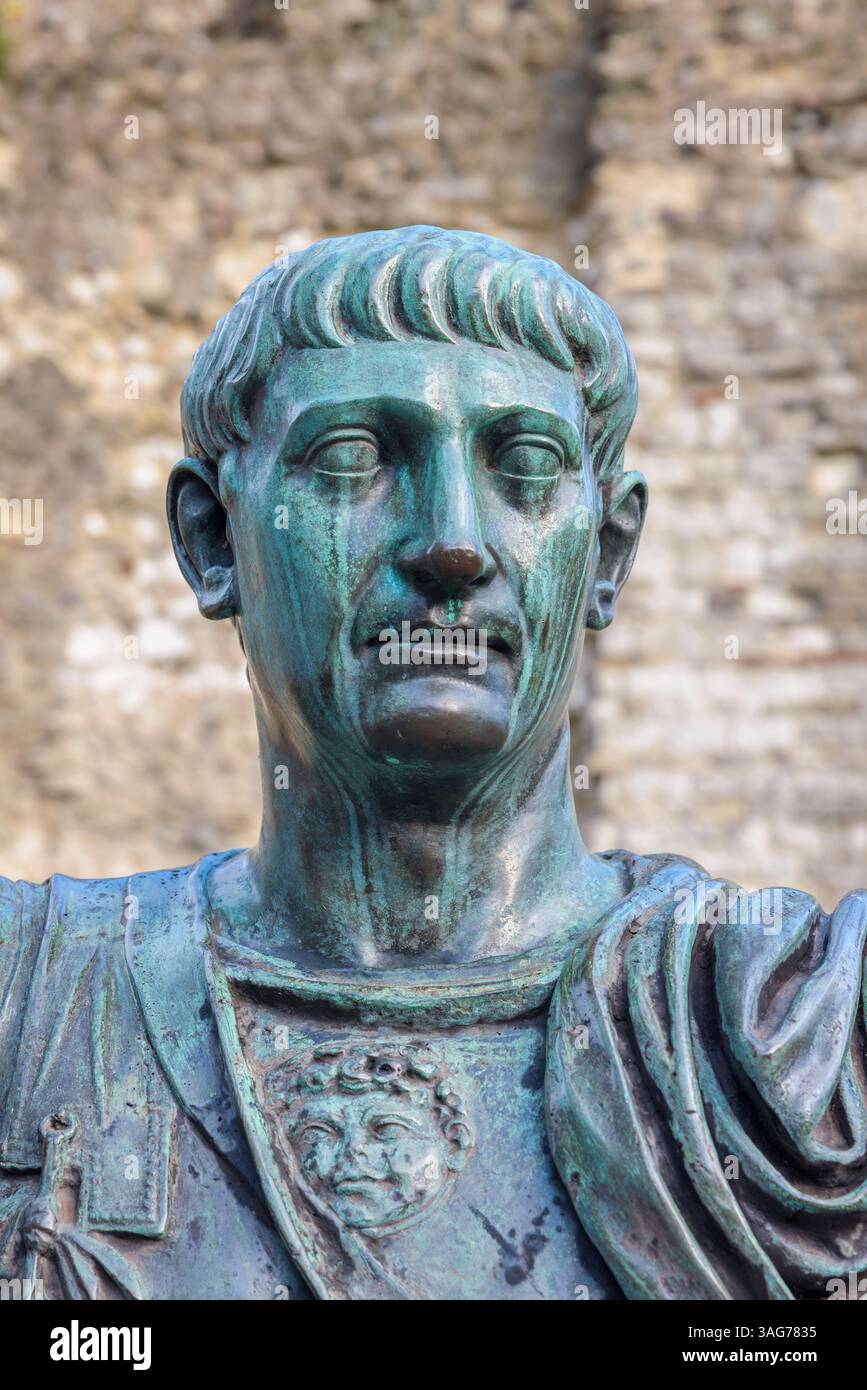 Bronze statue of Roman Emperor Trajan before remains of London Wall ...