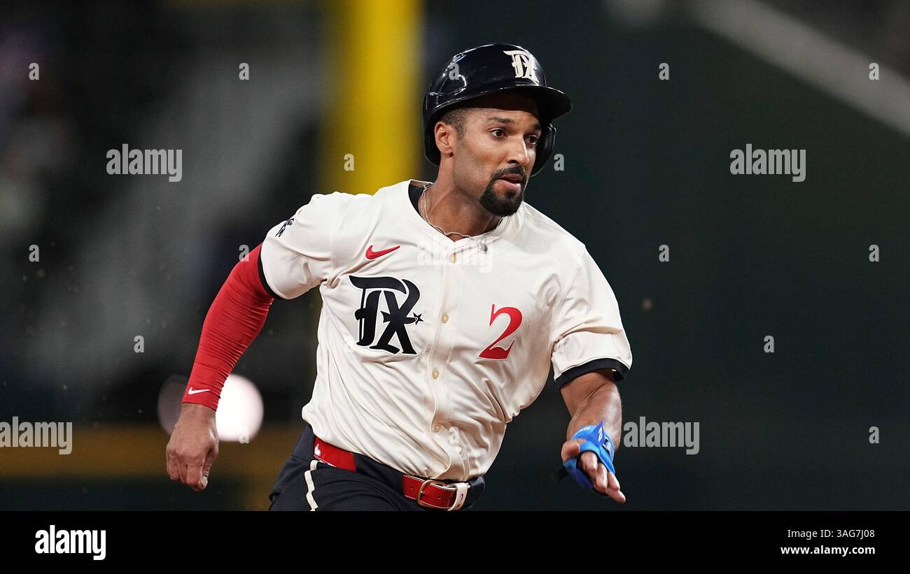 Texas Rangers' Marcus Semien sprints to third during a baseball game ...