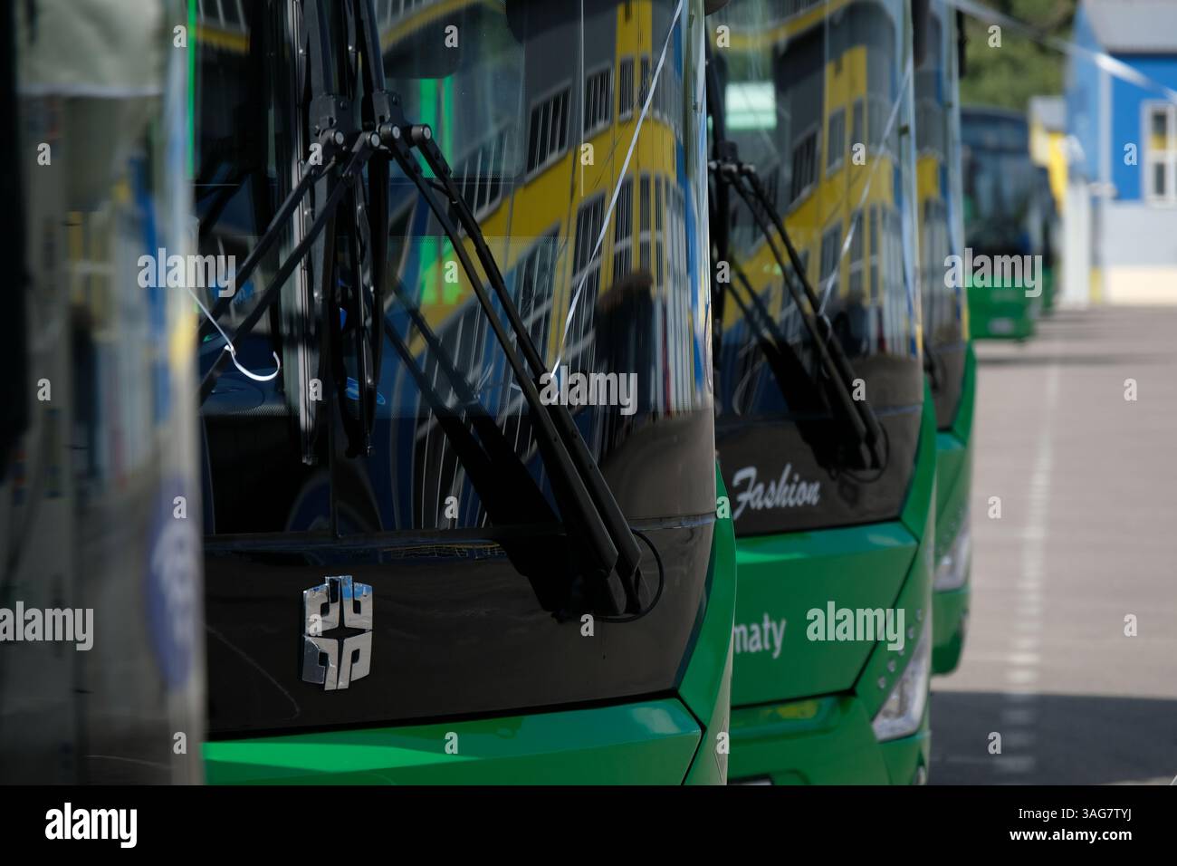 City buses stand behind each other in a large Parking lot of the fleet ...