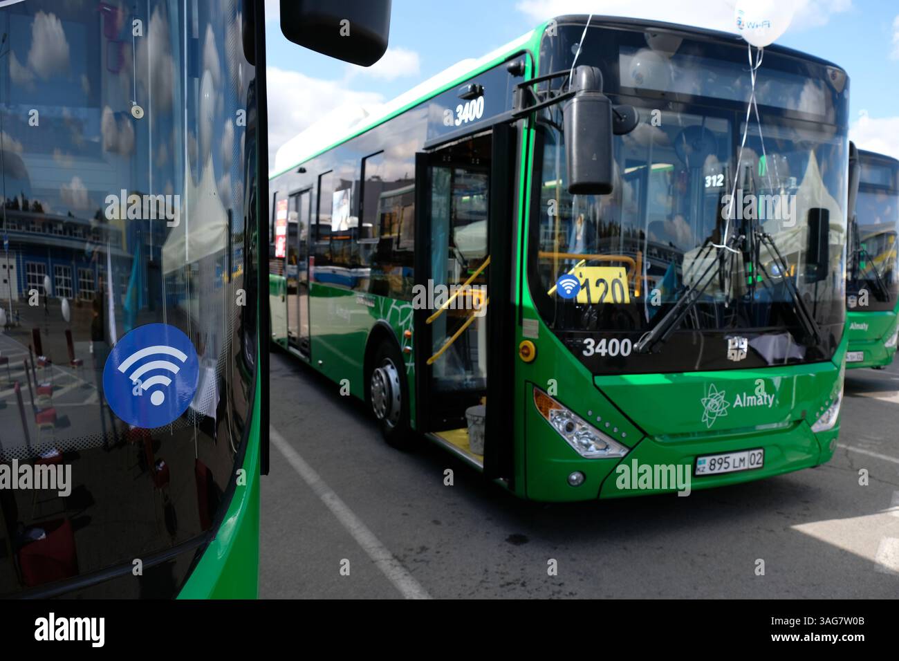 City buses stand behind each other in a large Parking lot of the fleet ...