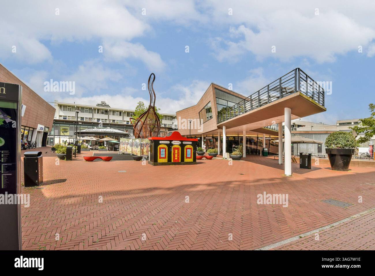 A vibrant outdoor shopping area featuring contemporary architecture ...