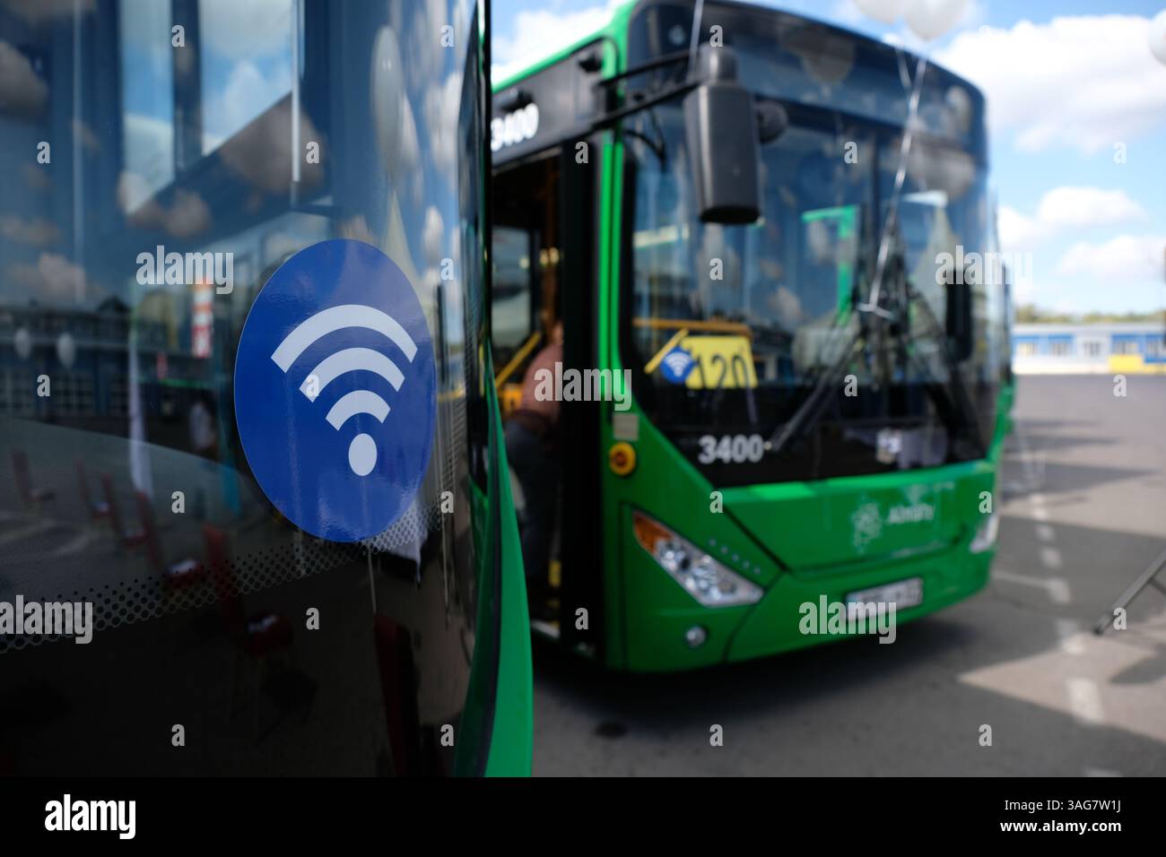 City buses stand behind each other in a large Parking lot of the fleet ...