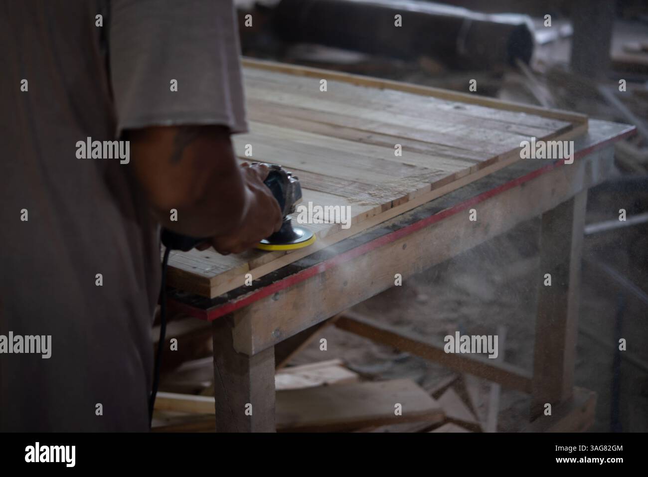 Asian carpenter build furniture or products from slat and timber wood ...