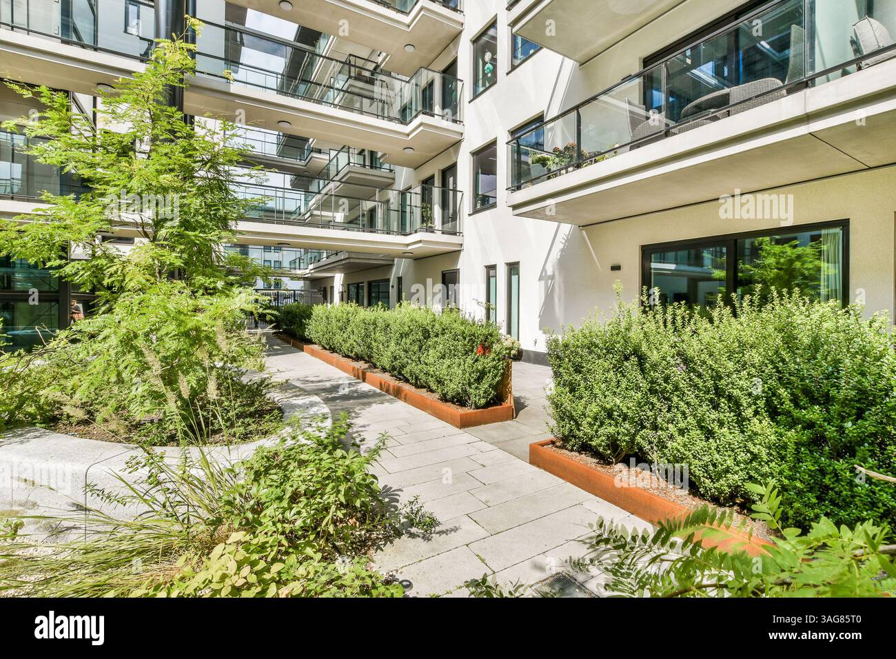A contemporary apartment complex featuring balconies and a well ...