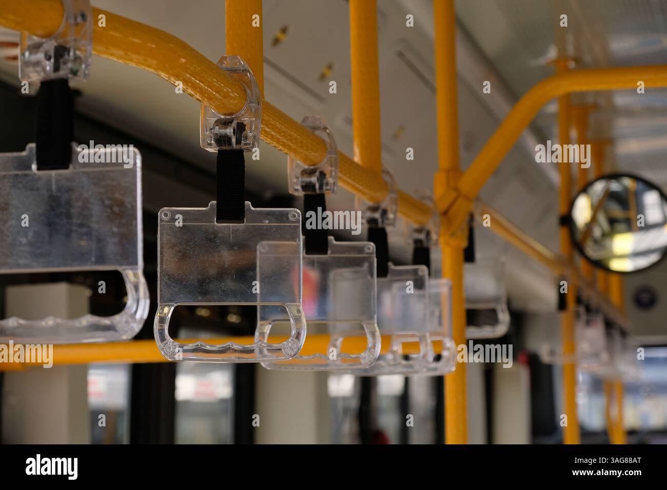 Plastic transparent handrails in a city bus Stock Photo - Alamy