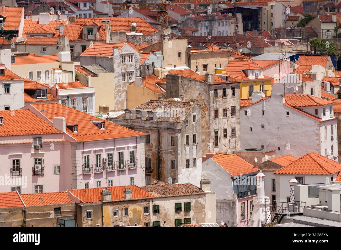 Dense urban view of Lisbon, Portugal, featuring colorful buildings and ...