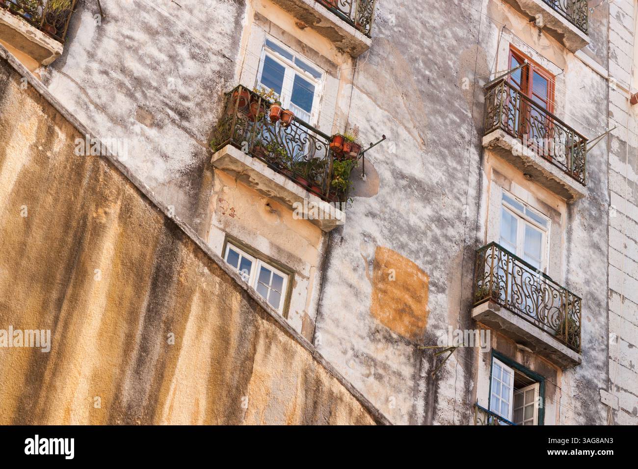 Colorful traditional facades line a quiet street in Lisbon, Portugal ...