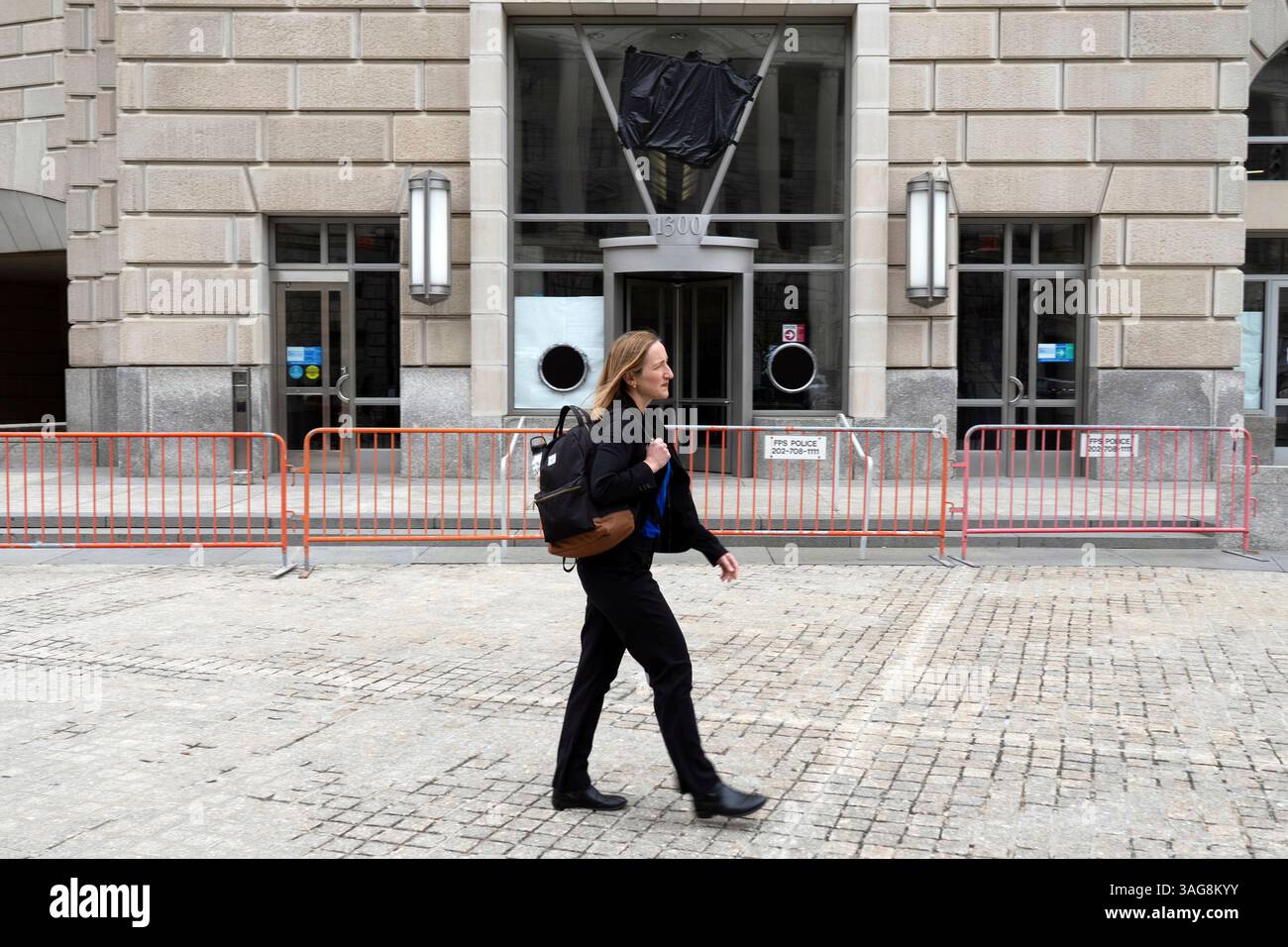 Laura Meissner walks in front of the United States Agency for ...