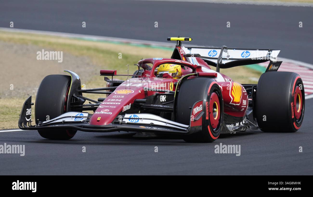 Ferrari driver Lewis Hamilton of Britain steers his car in the ...