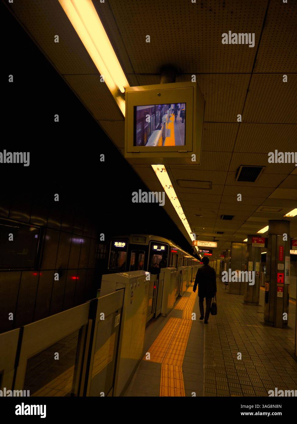Osaka Subway Scene - Man in Motion as Subway Arrives, Osaka, Japan ...