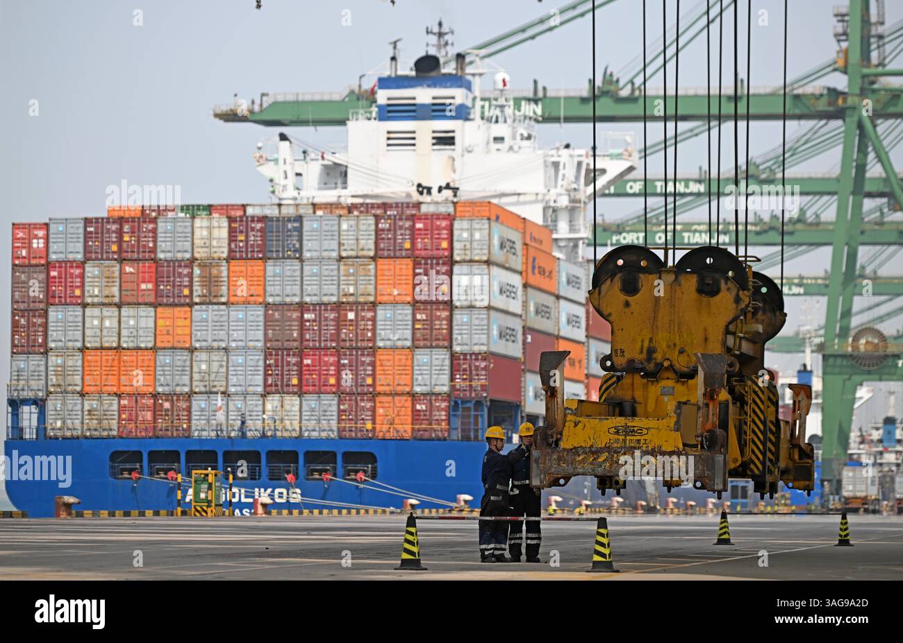 Tianjin. 8th Apr, 2025. Workers check a piece of equipment at a ...