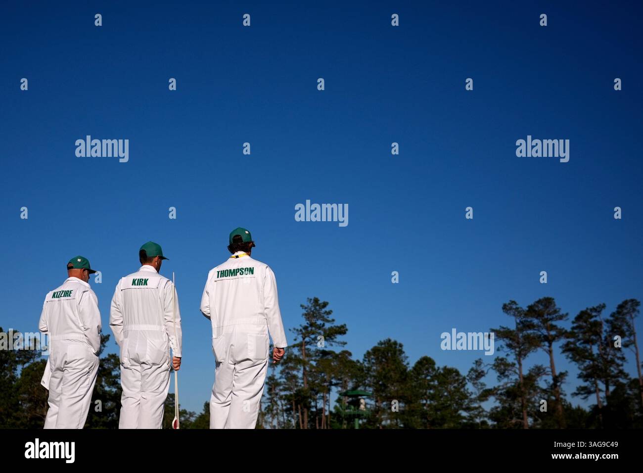 From left, Dean Emerson, caddie for Patton Kizzire, Michael Cromie ...