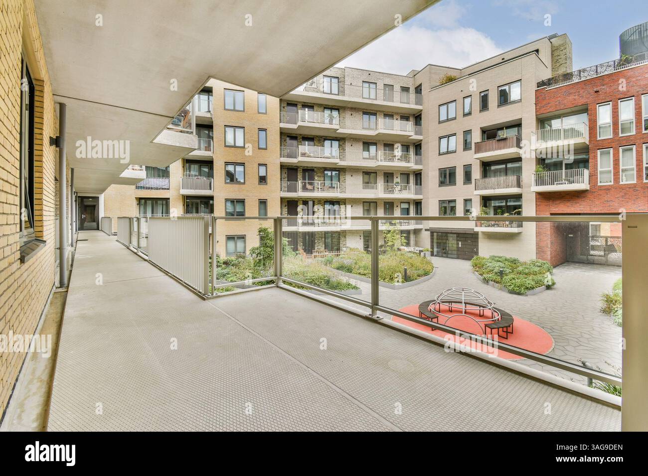 A contemporary apartment building view showcasing balconies, a ...