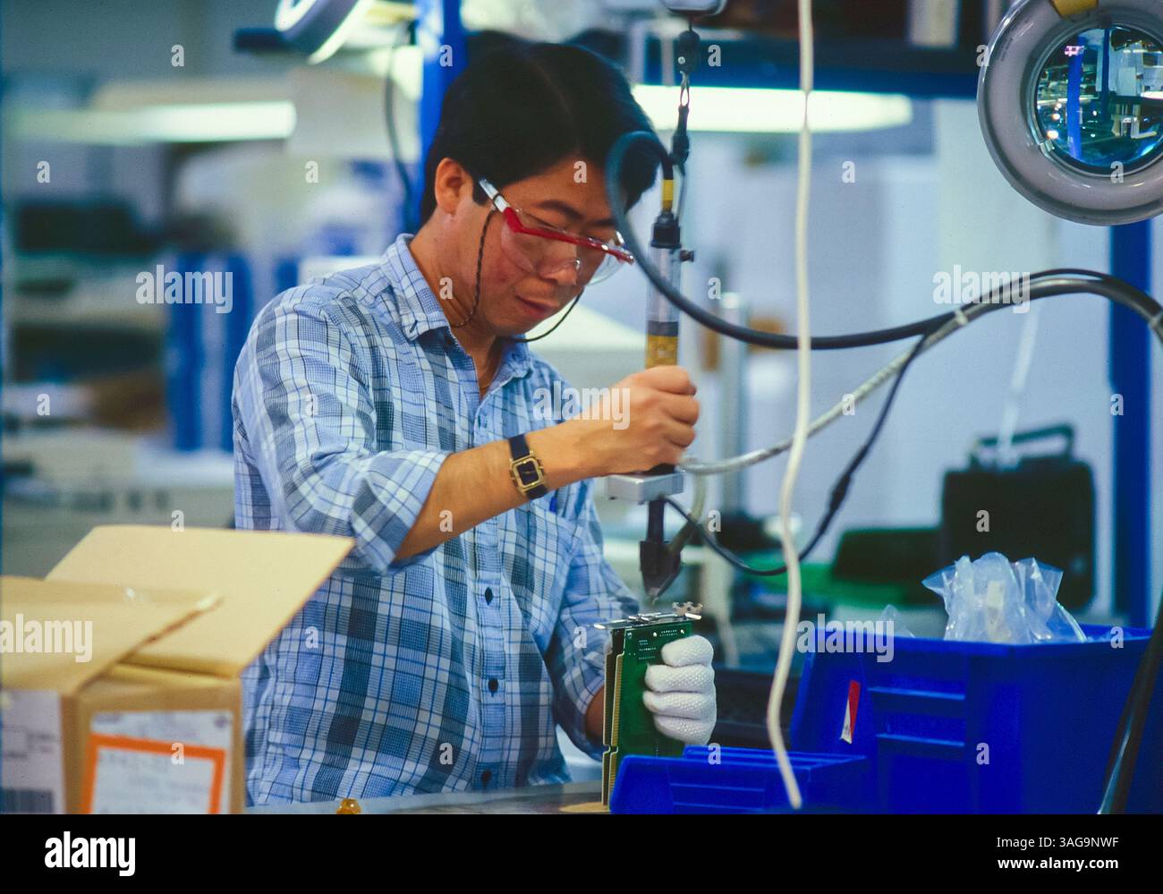 Santa Clara, California, USA, 3-Com Corporation, Asian Man Working ...