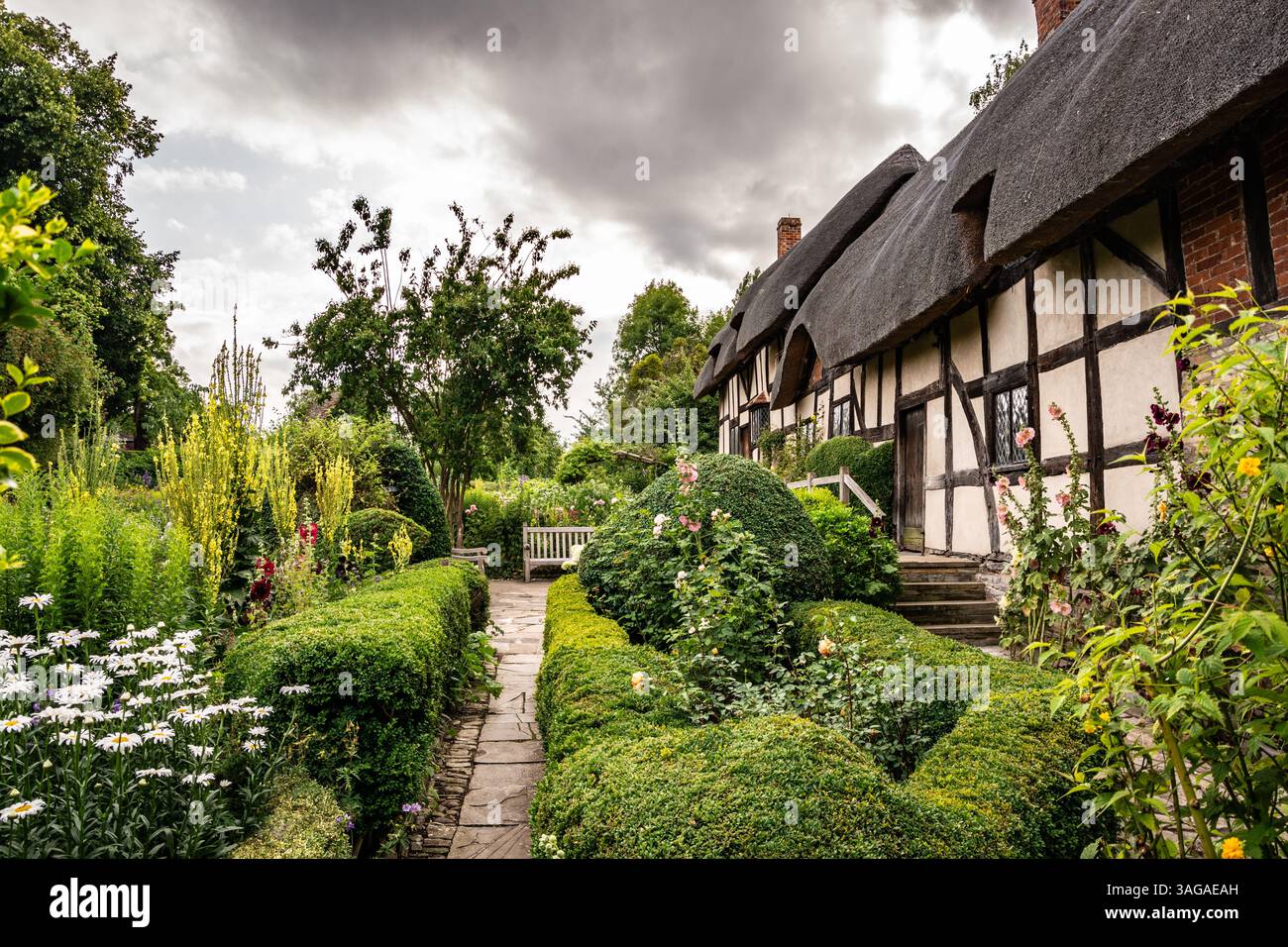 Quaint thatched cottage and garden of Anne Hathaway, Shakespeare's wife ...