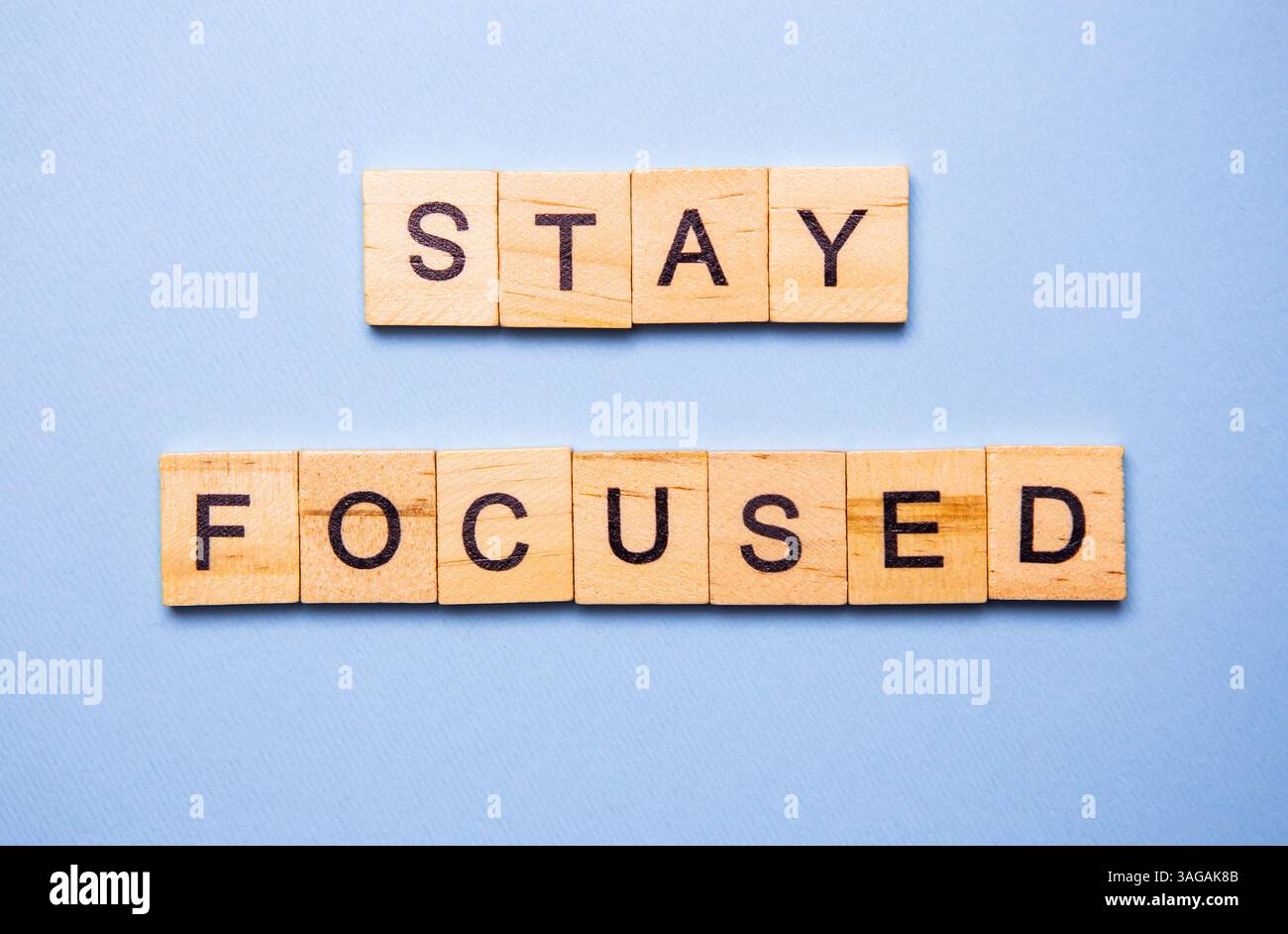 Wooden blocks spelling out the motivational message 'Stay Focused' on a ...