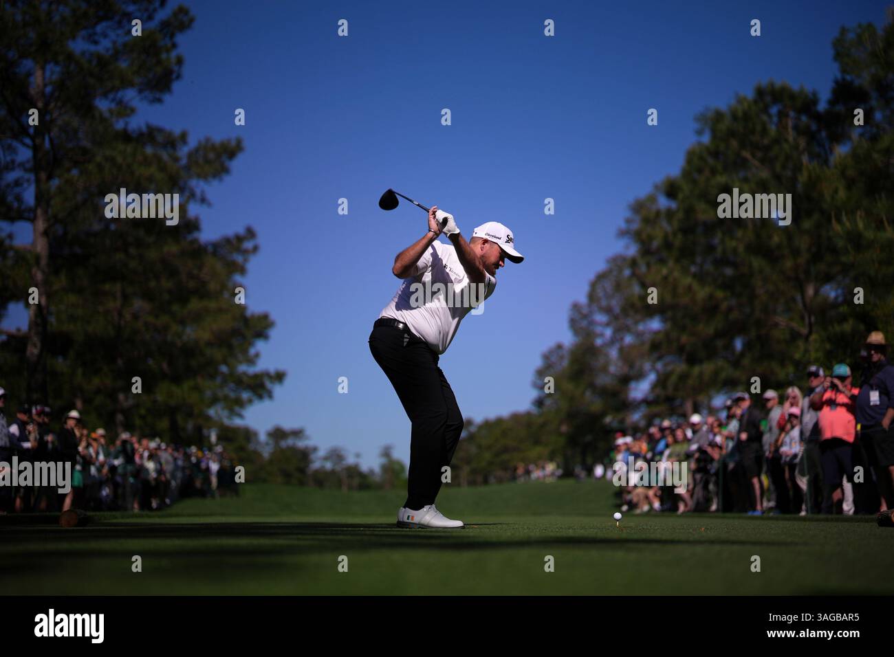 Shane Lowry, of Ireland, hits from the 15th tee during a practice round ...