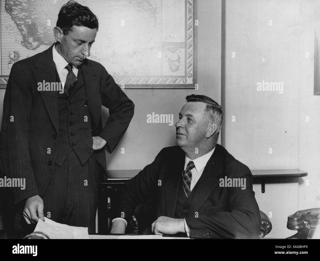Photo Shows Mr. Richard ***** in conference with his private secretary ...