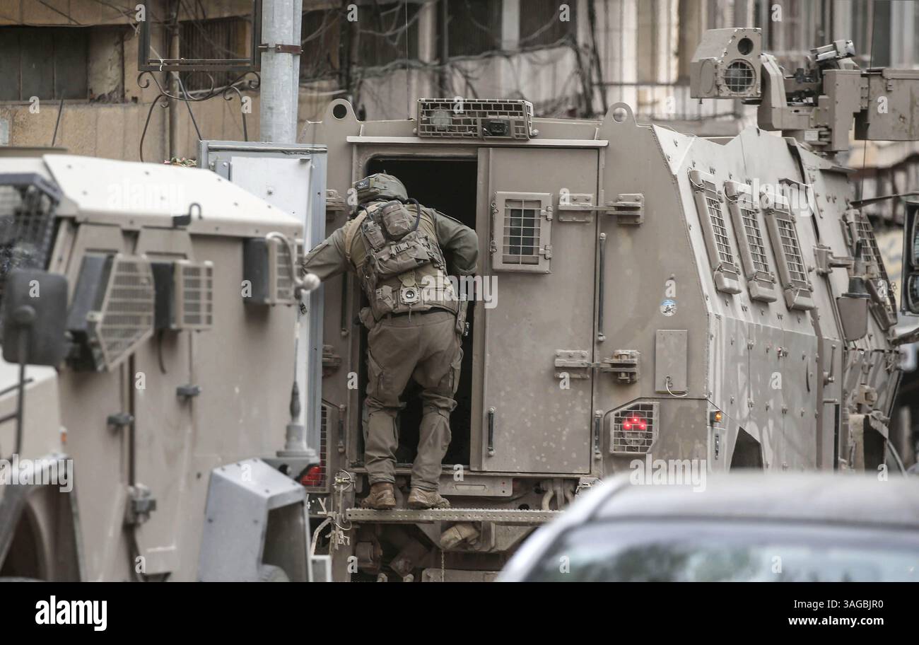 Nablus, Palestine. 08th Apr, 2025. An Israeli soldier takes a position ...