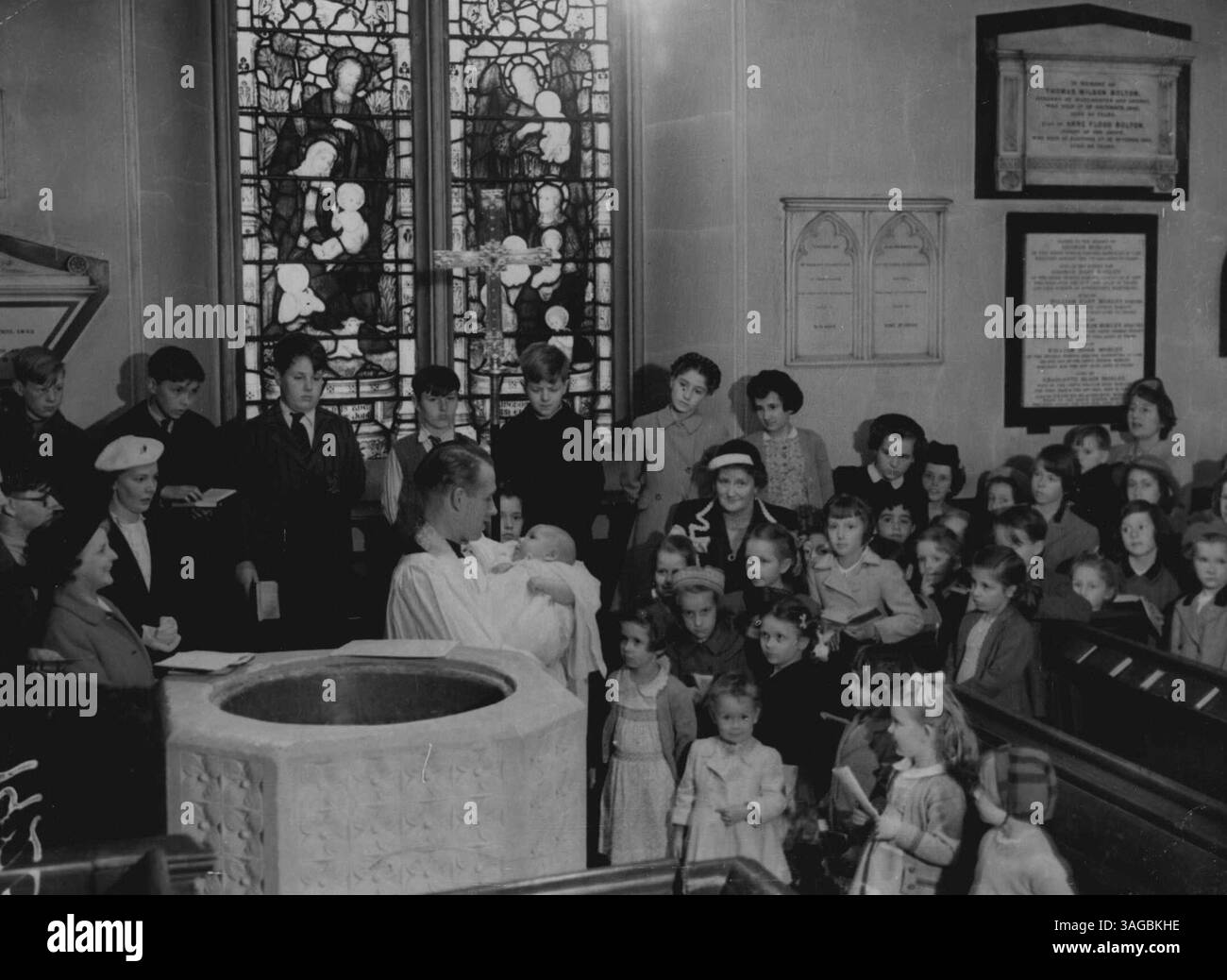 Christening Schoolchildren watched intently whilst Colin Frajbis was ...