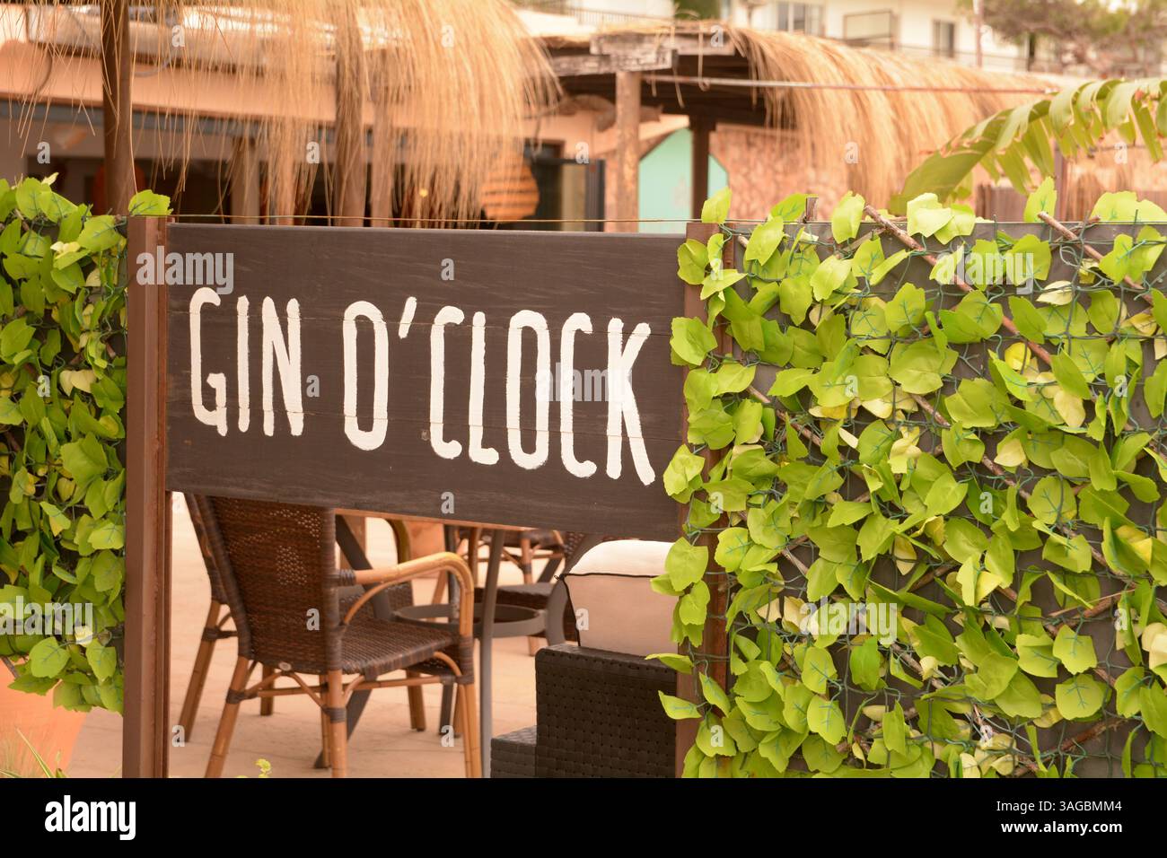 Gin O'Clock painted sign Stock Photo - Alamy