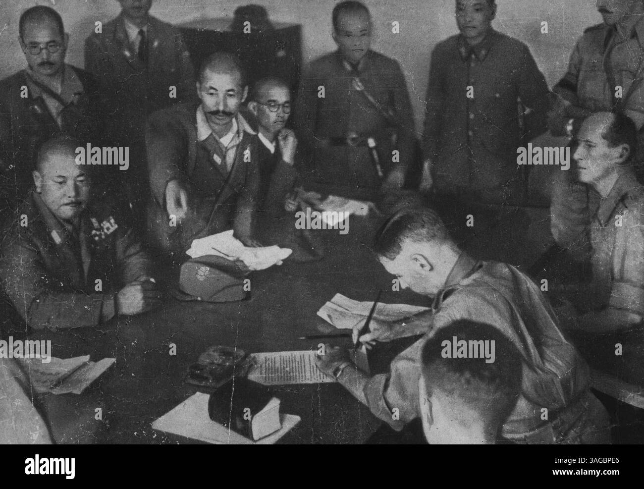 The British Commander-in-Chief, General Percival, signing surrender ...